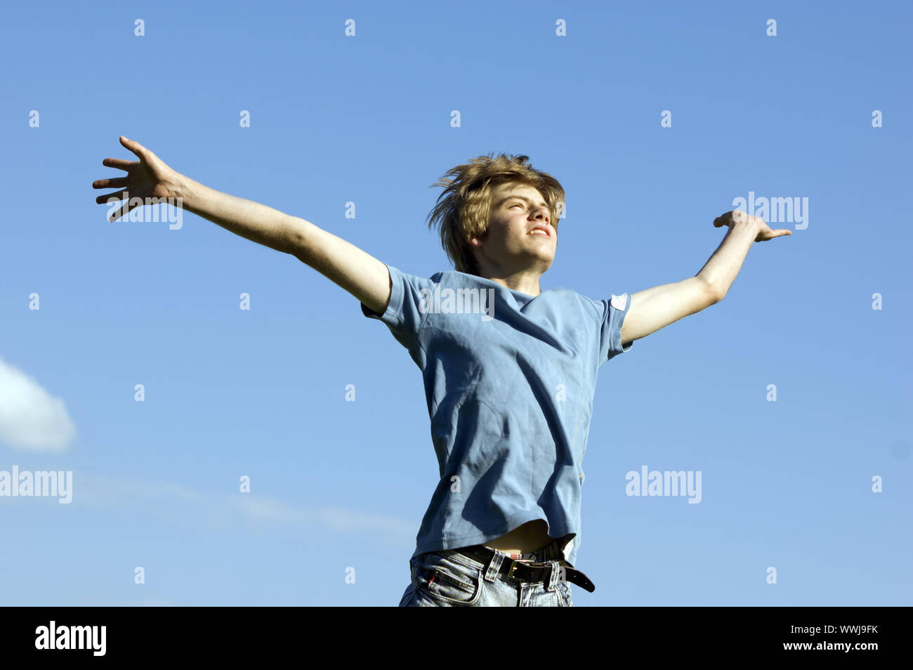 Happy boy jumping with joy Stock Photo - Alamy