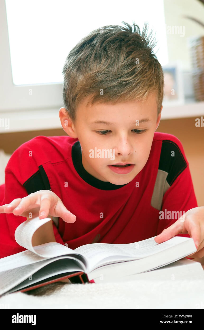 Teen boy studying on bed hi-res stock photography and images - Alamy