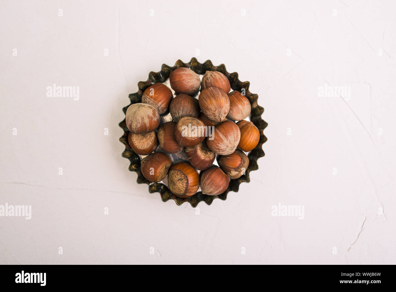 Hazelnuts in a plate. Inshell nuts close-up. Healthy eating concept ...