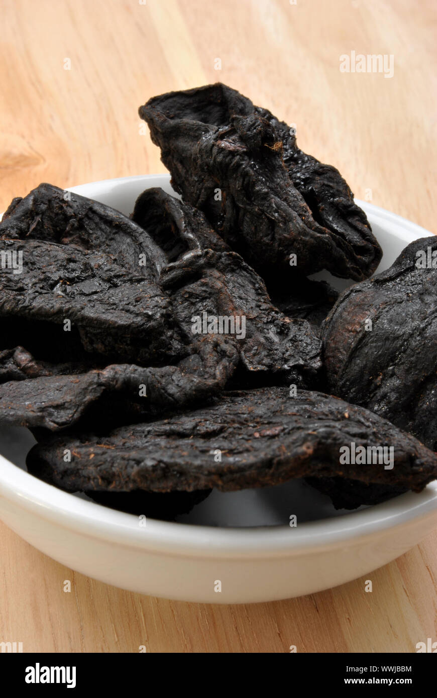 organic black tamarind in a white bowl Stock Photo - Alamy