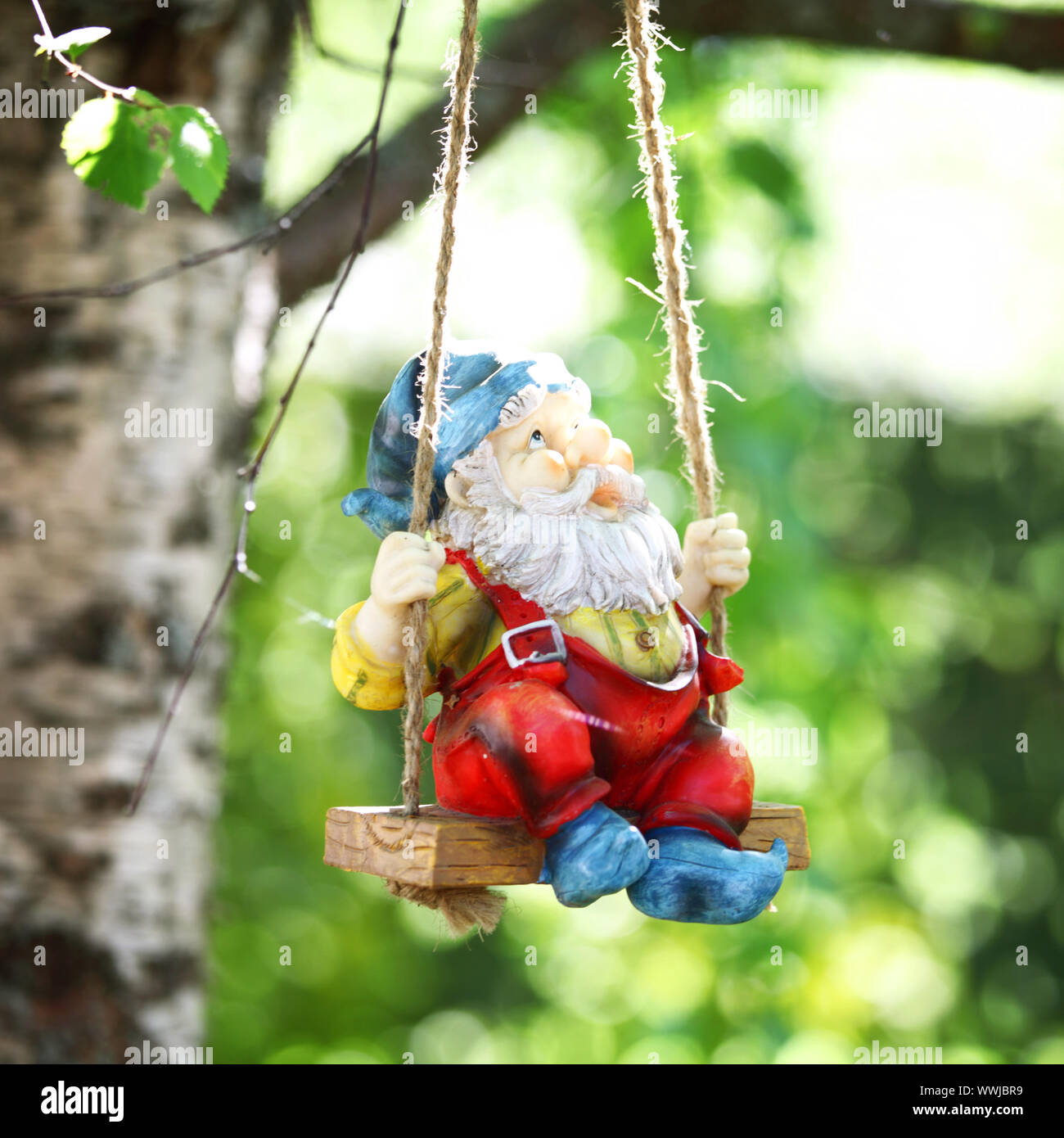 garden dwarf on green nature background Stock Photo - Alamy