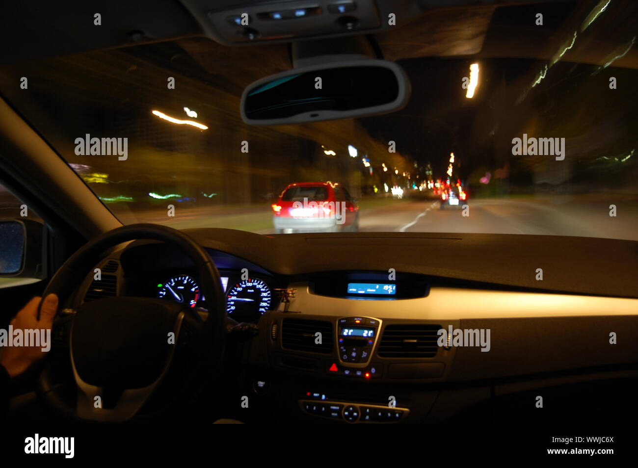 night drive with car in motion through the city shows the speed Stock ...