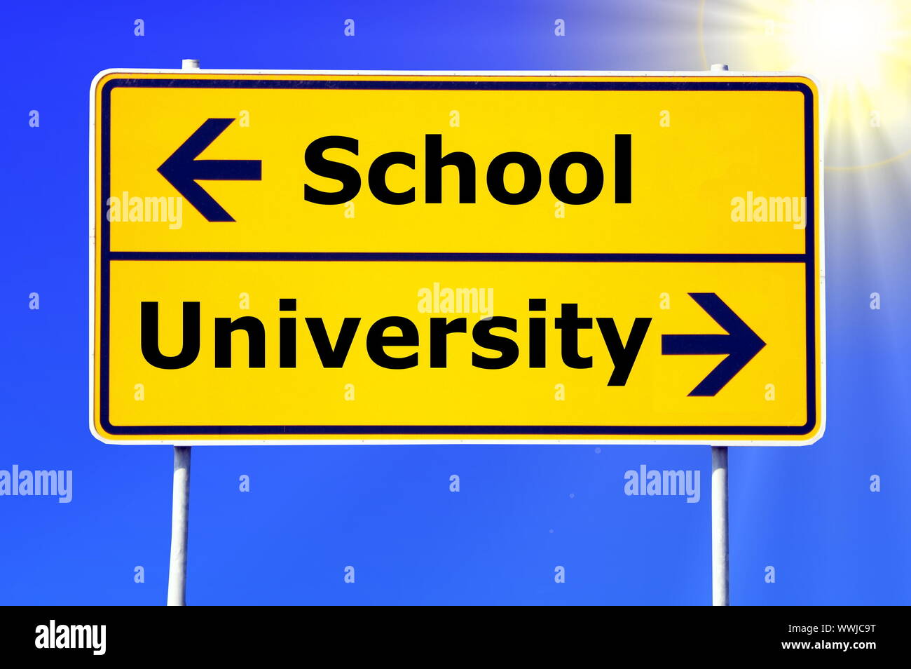 school and university education concept with yellow road sign Stock ...