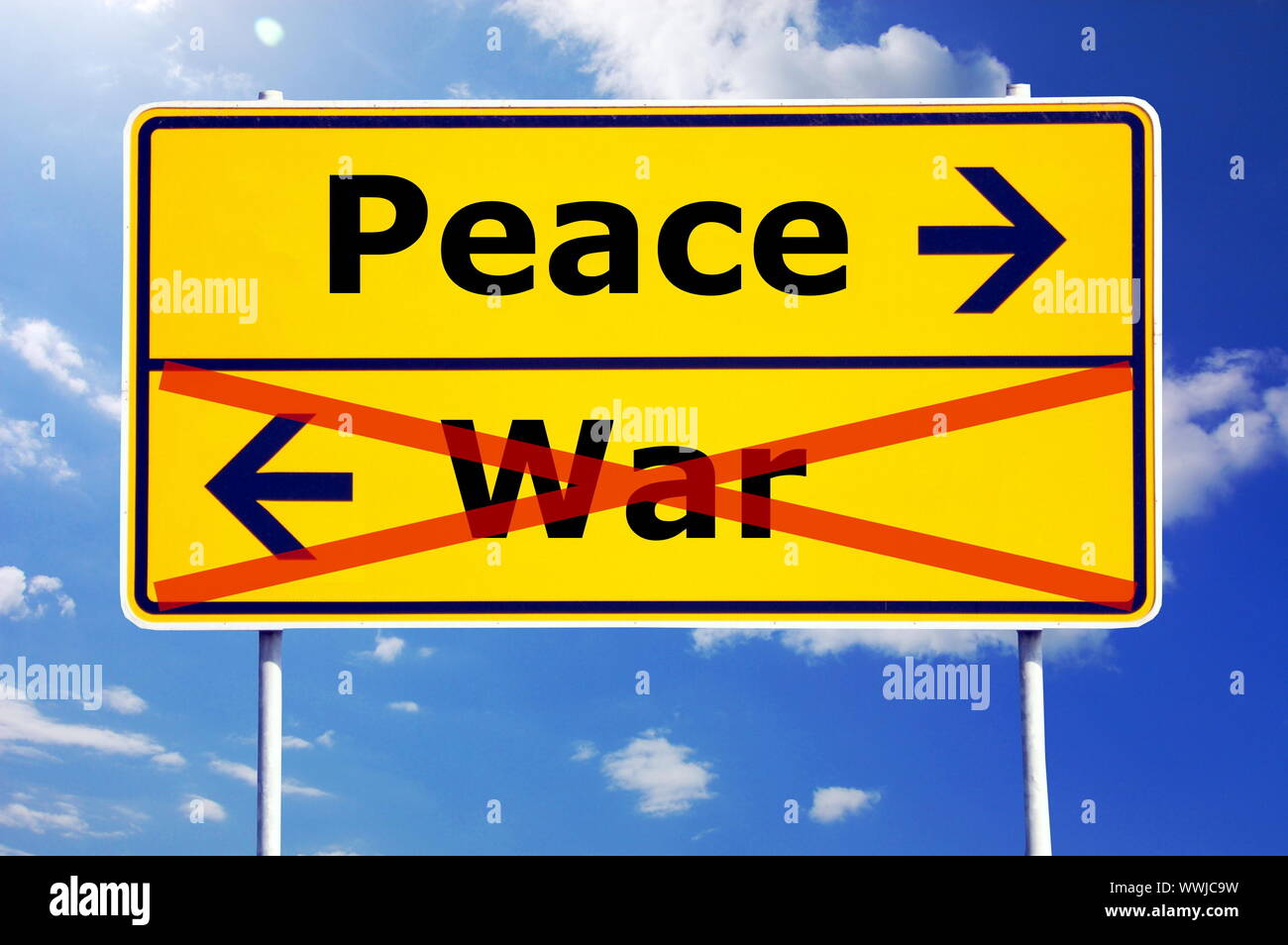 peace and war concept with yellow road sign Stock Photo - Alamy