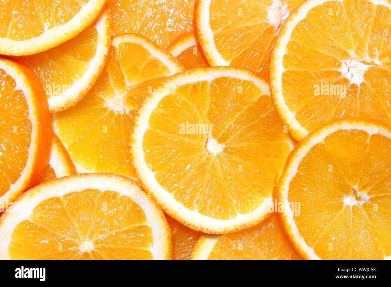 healthy orange fruit background with sliced oranges Stock Photo - Alamy