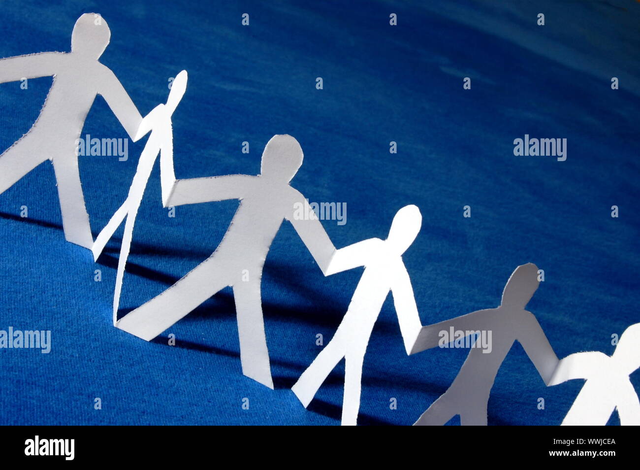 paper people doing teamwork in their business Stock Photo - Alamy