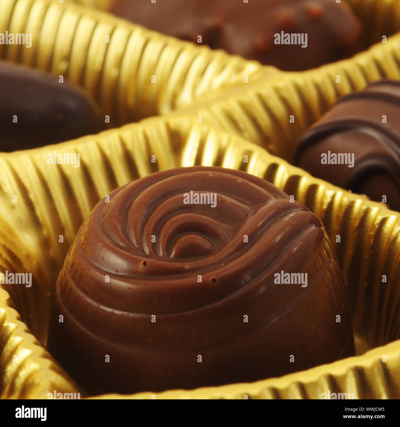 praline candy in an golden exclusive box Stock Photo - Alamy