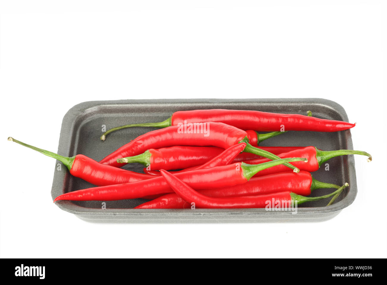 chilli pepper pack isolated on white background Stock Photo - Alamy
