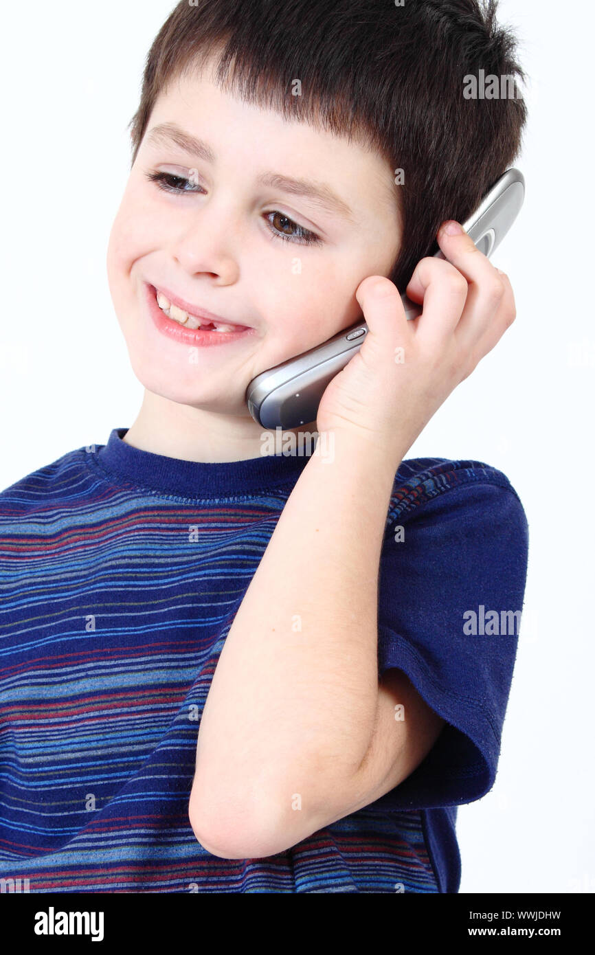 Small boy calling from mobile phone to friend on white background Stock ...