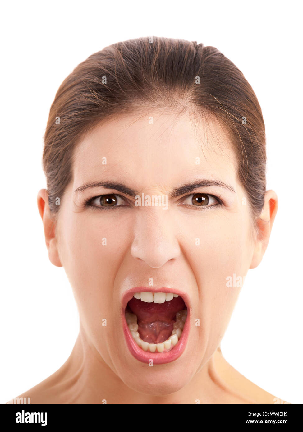 Close-up portrait of a angry woman shouting, over a white background ...