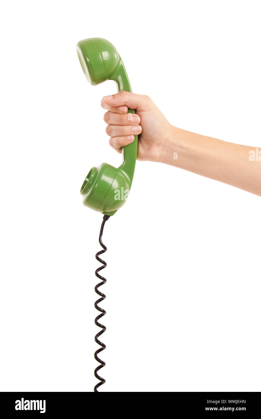 Female hand holding a green handpiece from a vintage telephone Stock ...