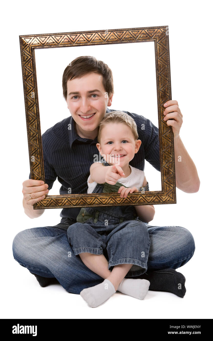 Casual portrait of father and son having fun together playing with ...