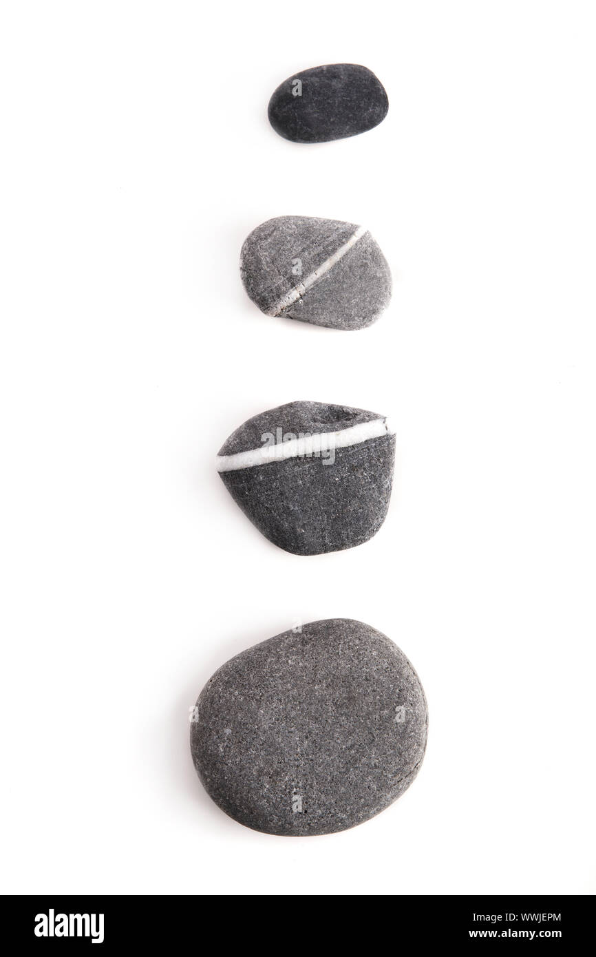 Four beautiful Spa stones isolated on white background Stock Photo - Alamy