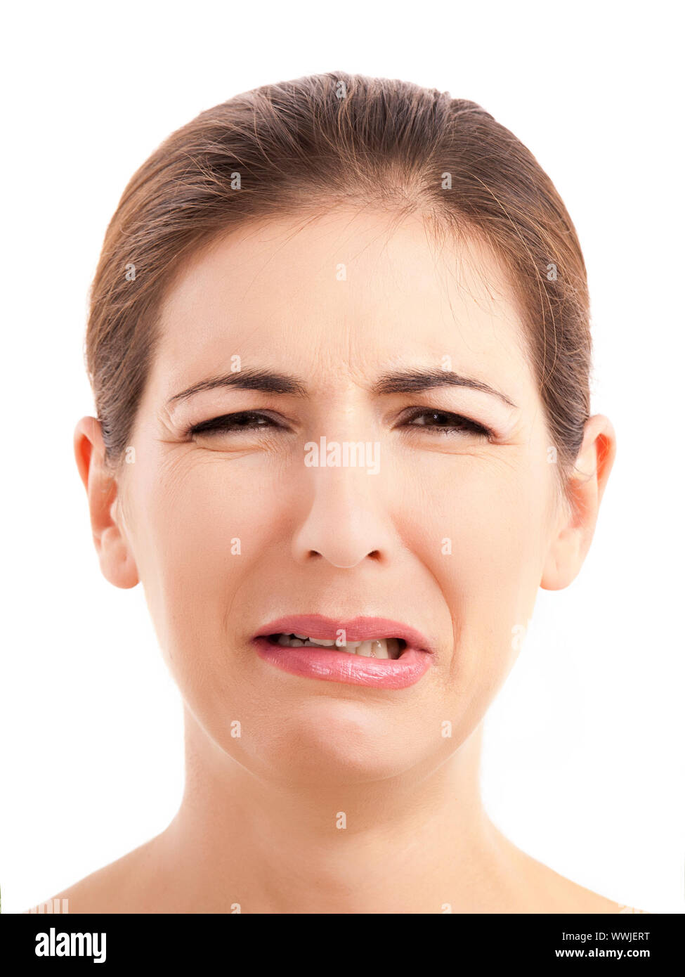 Close-up portrait of a woman with a crying face, over a white ...