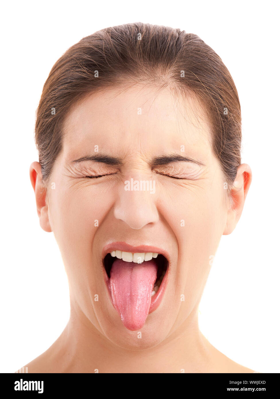 Close-up portrait of a funny woman pulling tongue out, isolated on ...