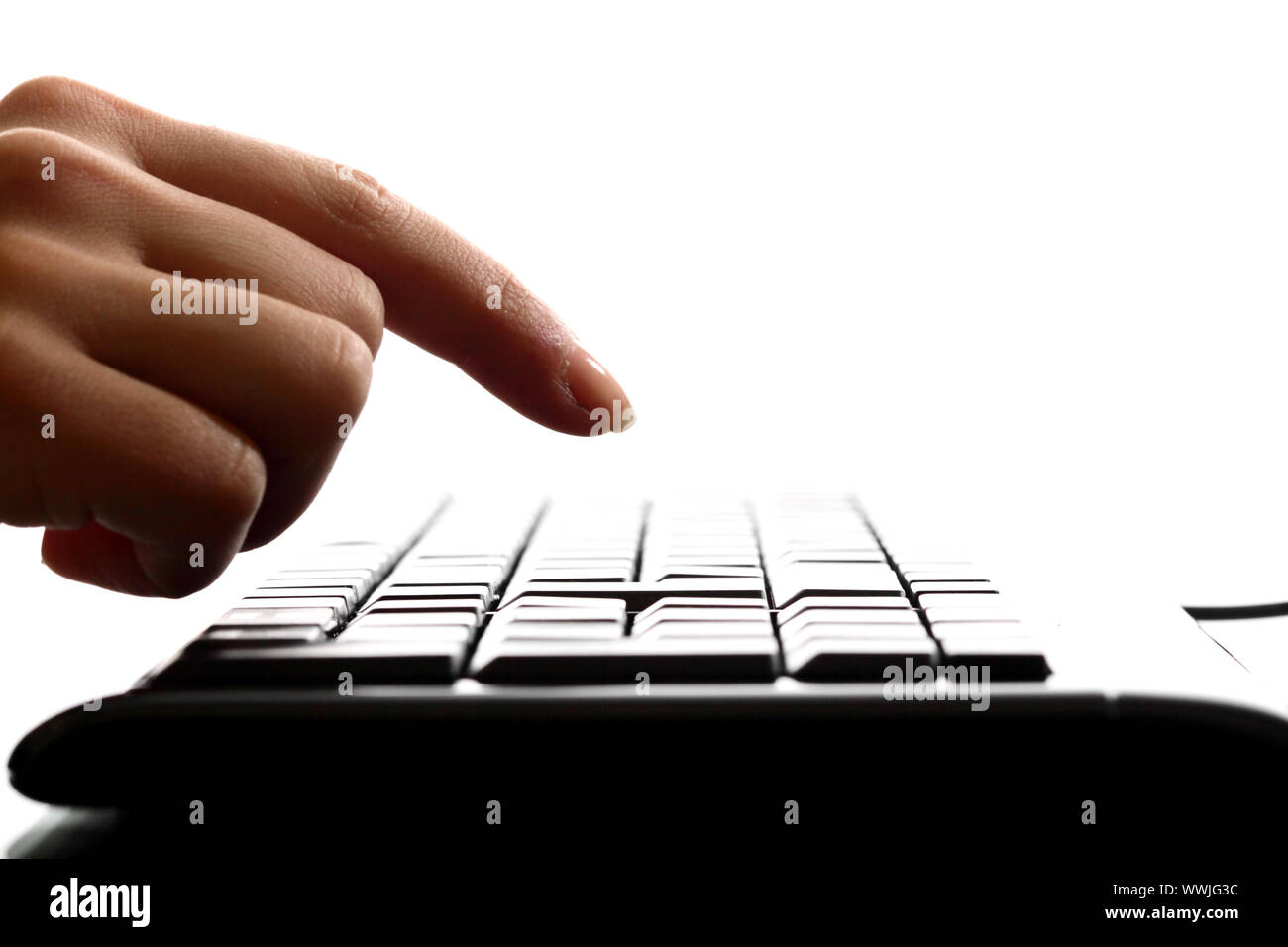 hand press a key on keyboard Stock Photo - Alamy