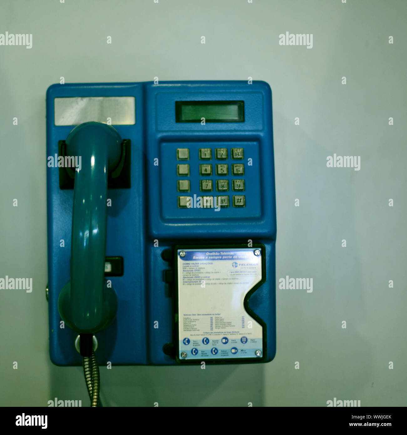 old phone on the wall in airport Stock Photo - Alamy