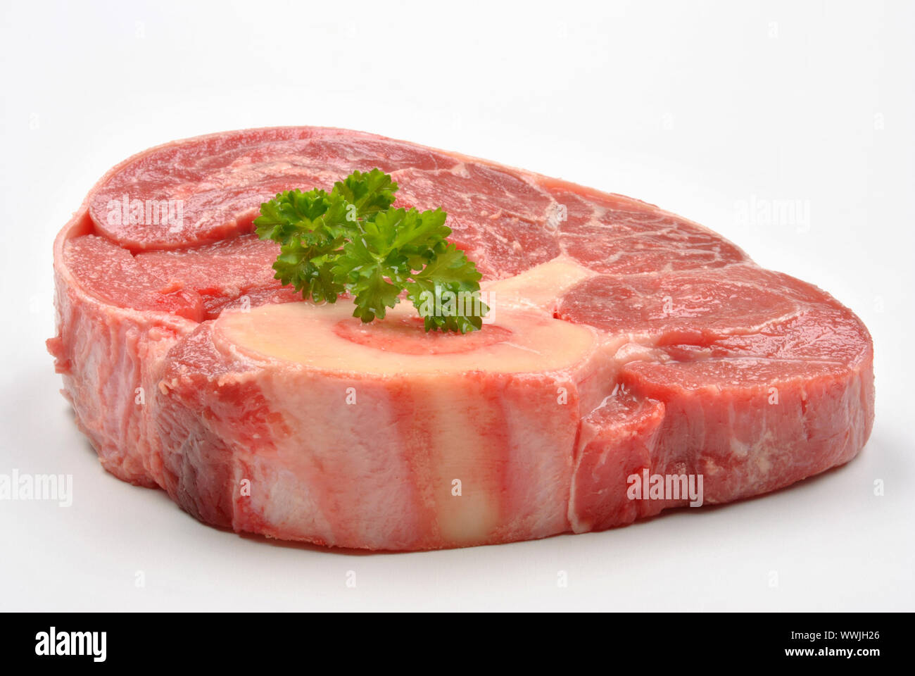 fresh organic beef shin steak and white background Stock Photo - Alamy