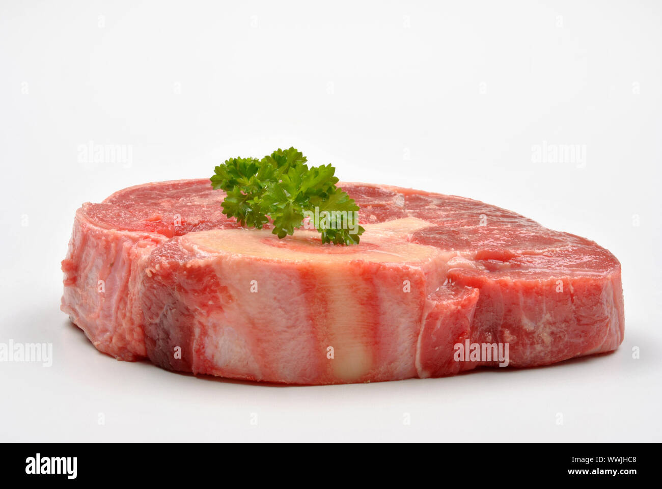 fresh organic beef shin steak and white background Stock Photo - Alamy