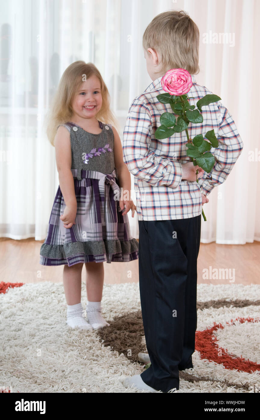 Boy giving rose bouquet girl hi-res stock photography and images - Alamy