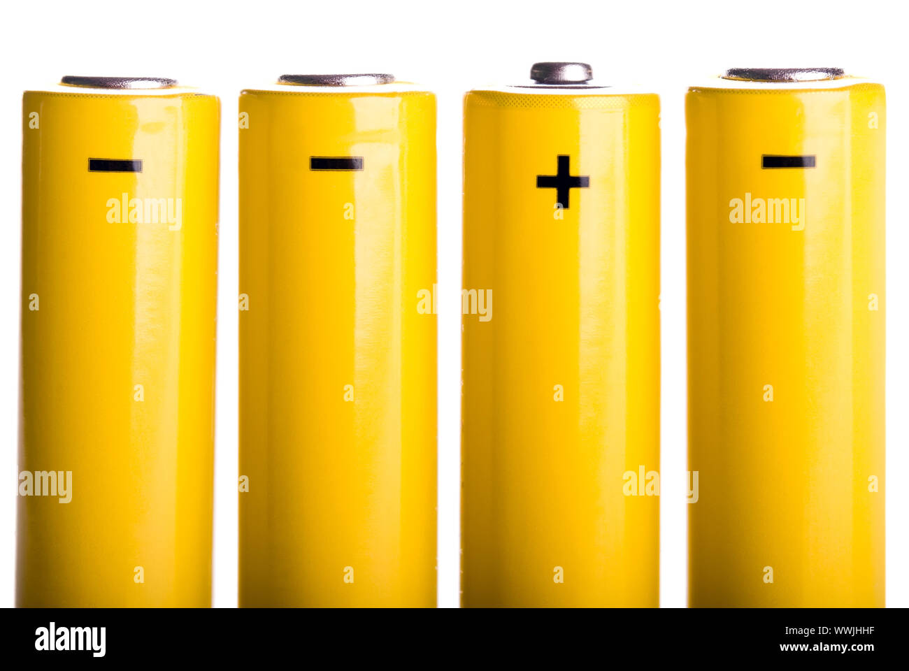 four yellow standing batteries Stock Photo - Alamy