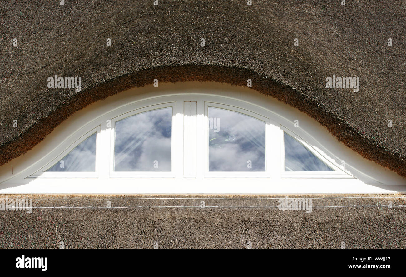 thatched roof with window Stock Photo - Alamy