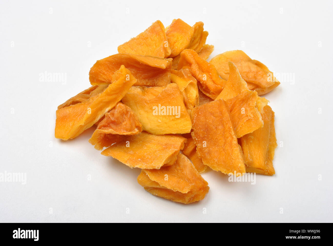 natural dried organic mango and a white background Stock Photo - Alamy
