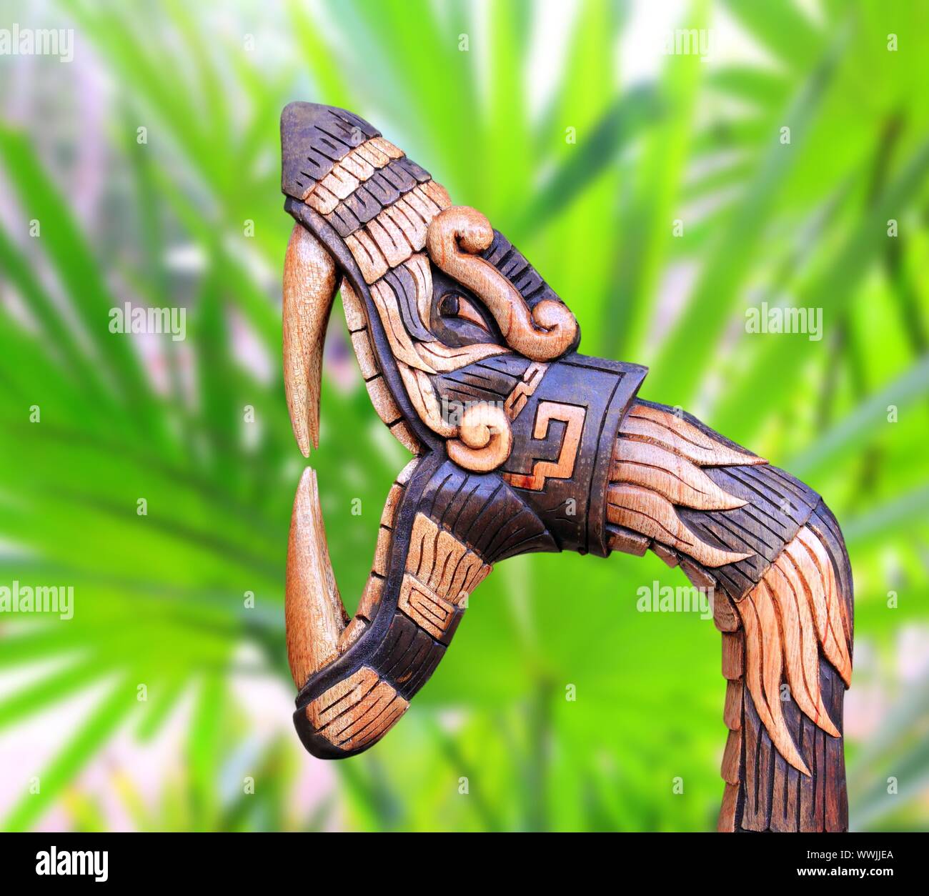 Chichen Itza Snake symbol wood handcraft figure in jungle Mexico ...