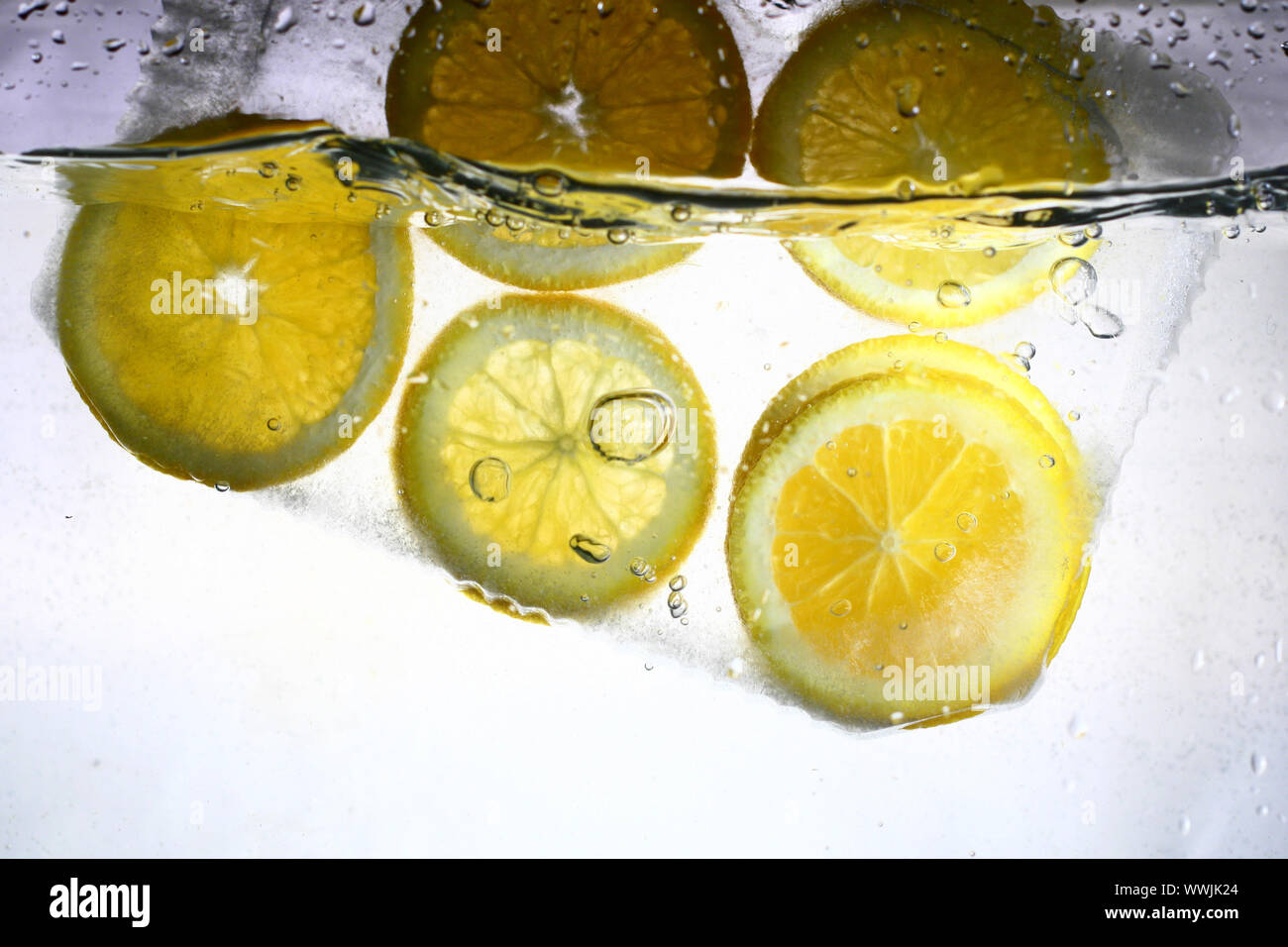 orange in ice cube frozen background Stock Photo - Alamy