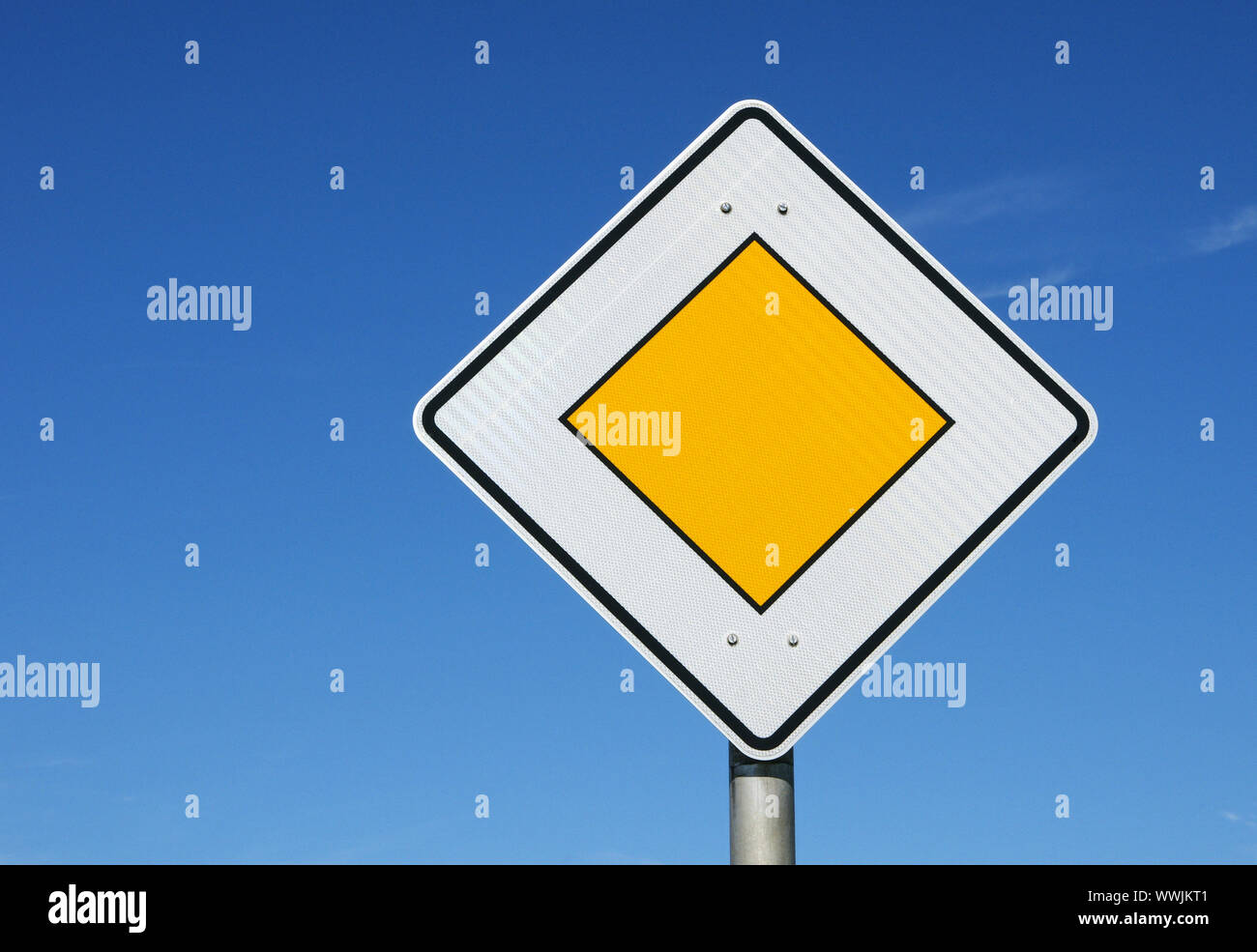 Right of way traffic sign with sky Stock Photo - Alamy