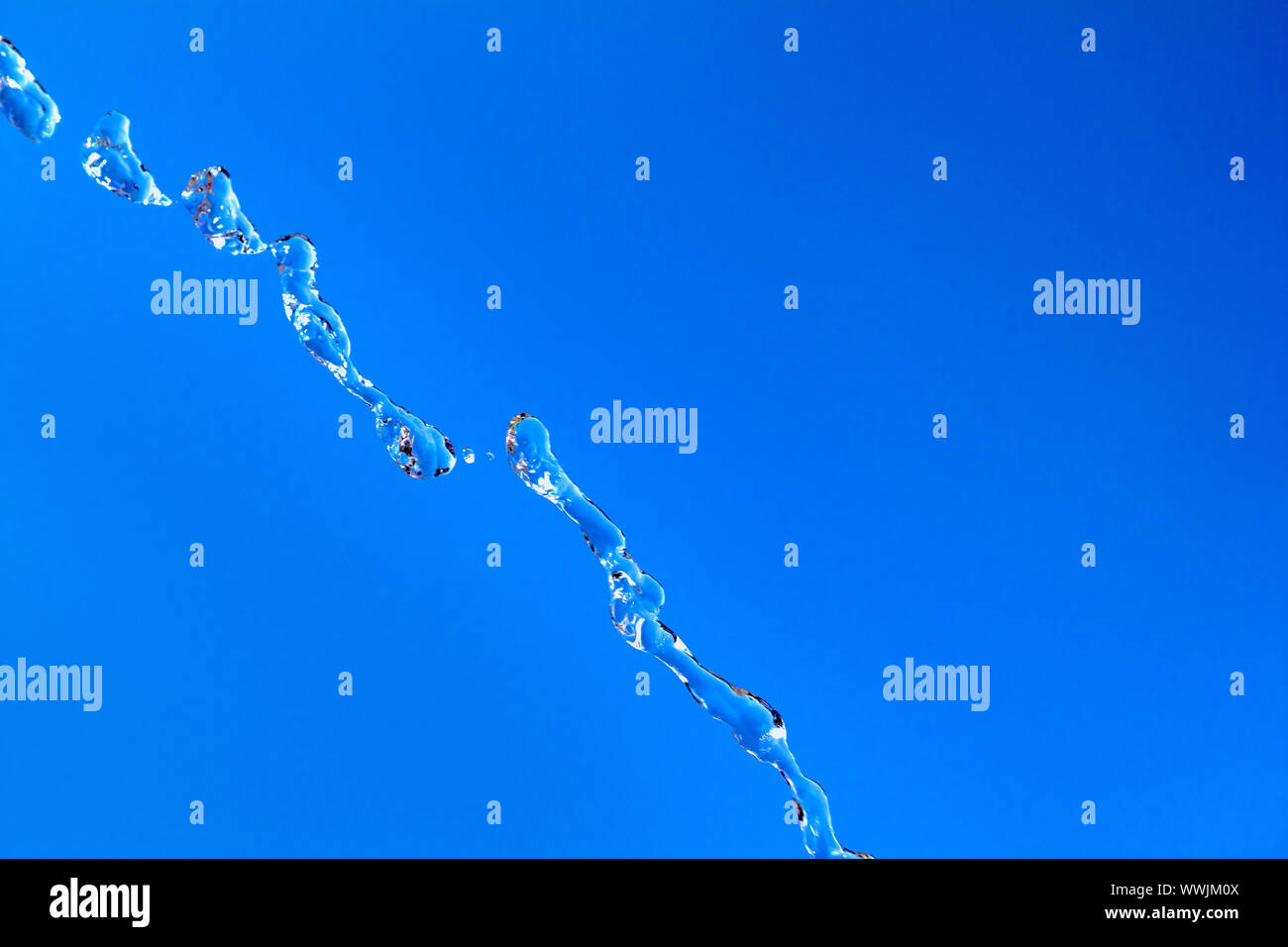 water splash line in blue sky background Stock Photo - Alamy