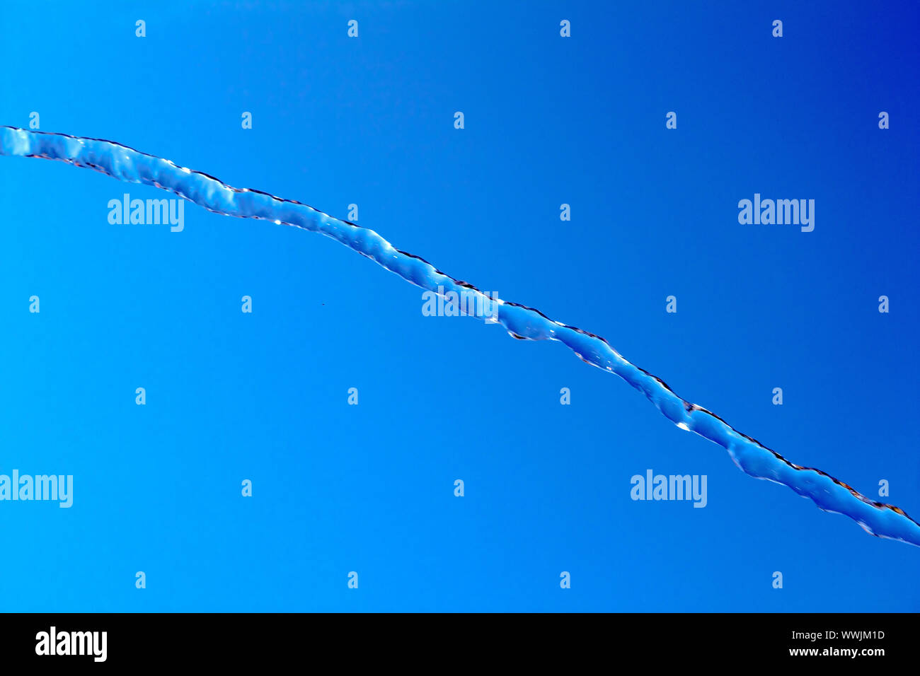 water splash line in blue sky background Stock Photo - Alamy