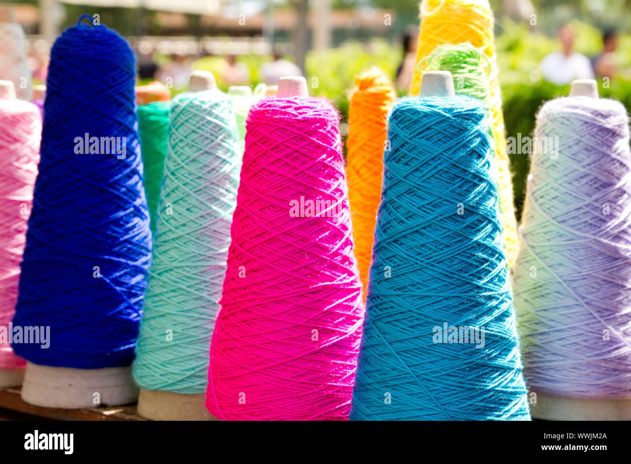 Embroidery colorful thread spool in rows Stock Photo - Alamy
