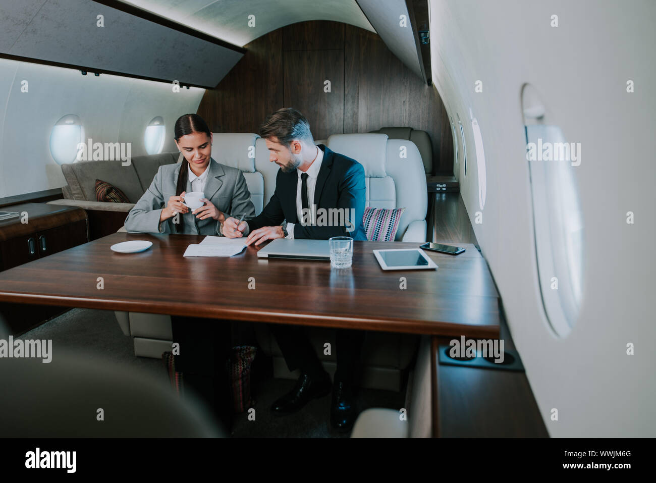 Business team on the private jet Stock Photo - Alamy