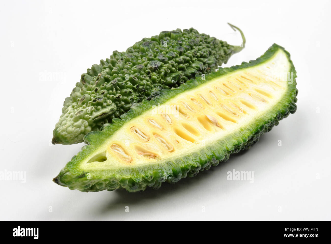 fresh organic karela and a white background Stock Photo - Alamy