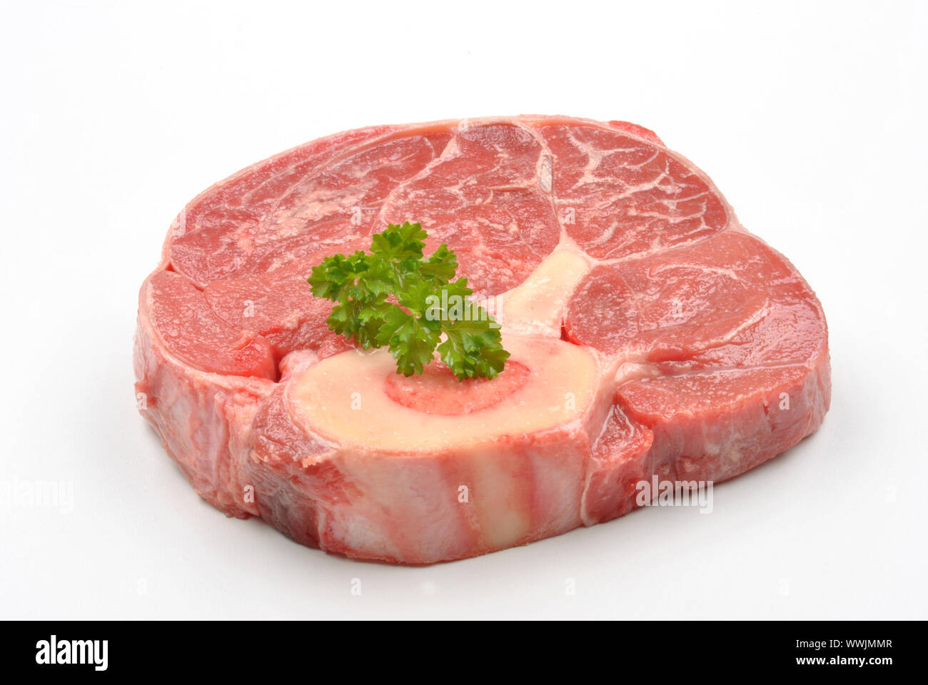 fresh organic beef shin steak and white background Stock Photo - Alamy
