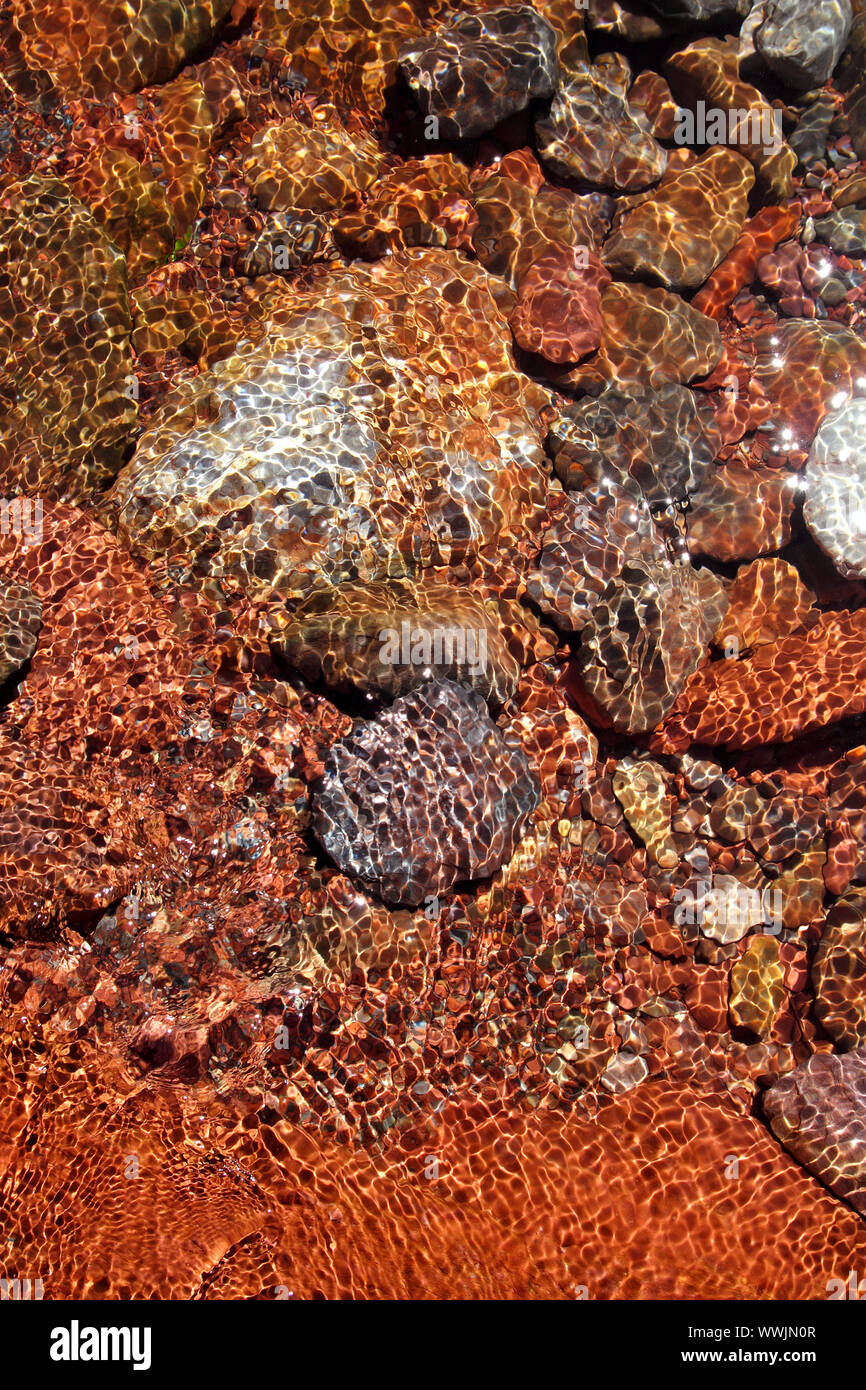 river water bottom stream red rocks transparency texture background ...