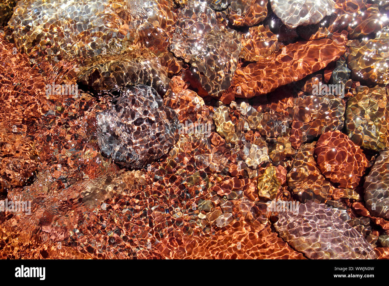 river water bottom stream red rocks transparency texture background ...