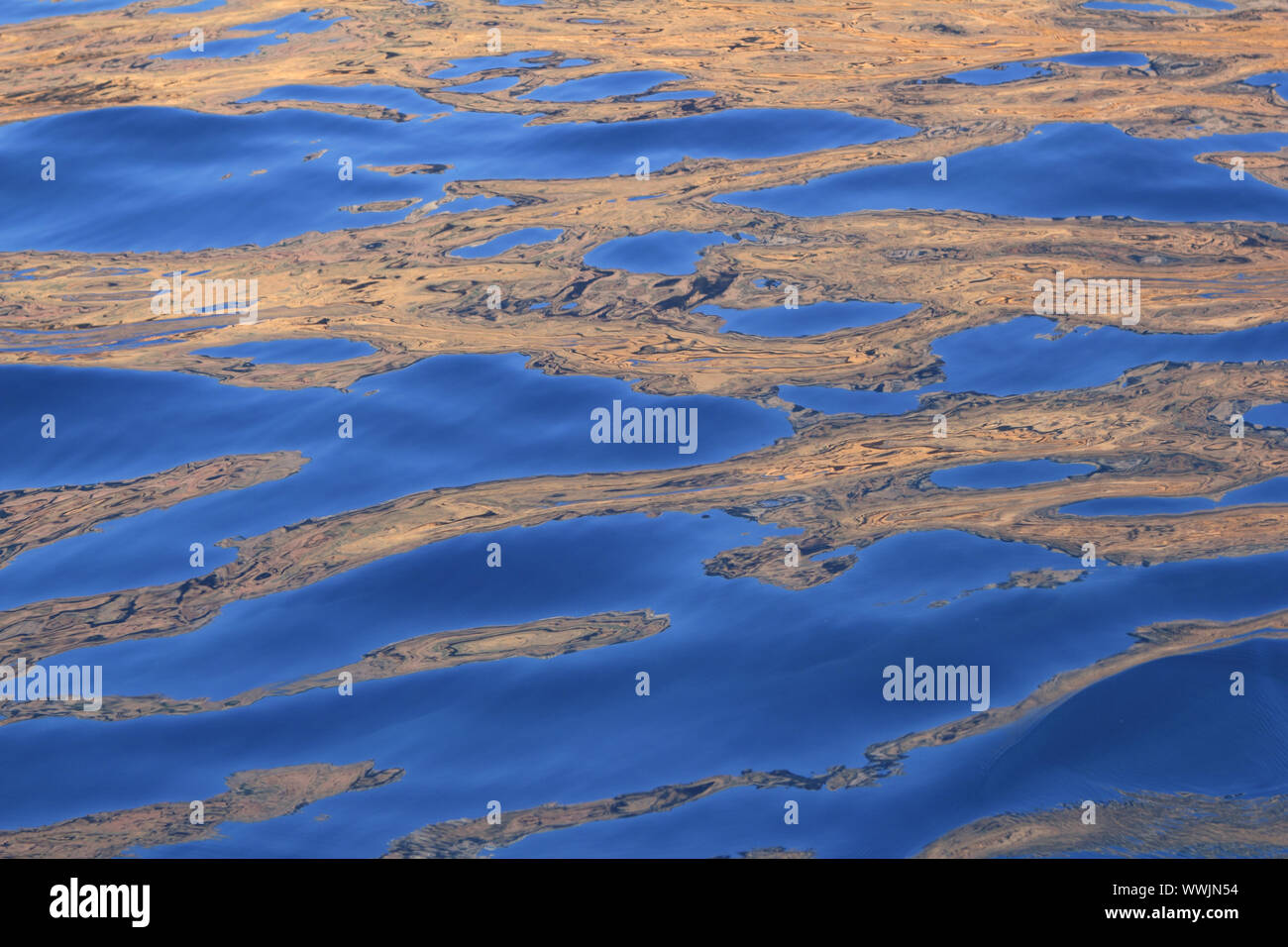 Abstract golden reflection blue water shapes texture background Stock ...