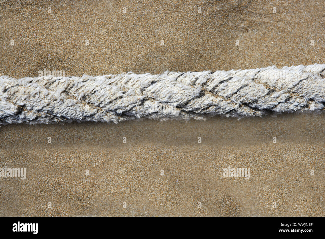 aged marine weathered rope over beach sand background summertime Stock ...