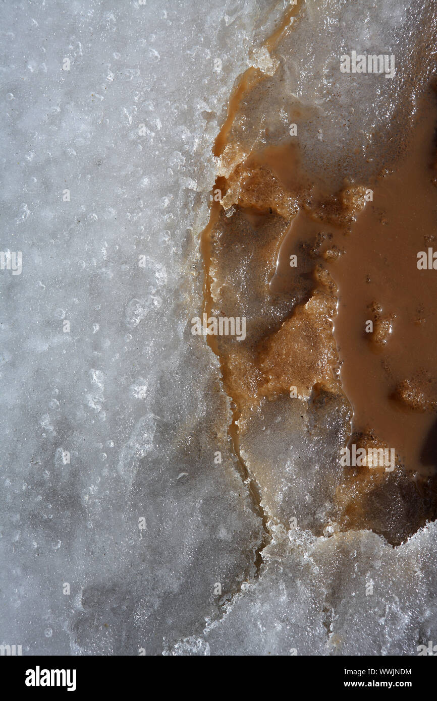 ice meltwater soil red clay mud background Stock Photo - Alamy