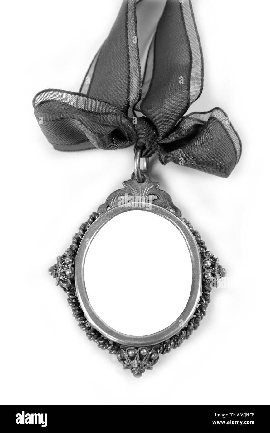 Cameo silver locket with tape loop copyspace isolated on white Stock ...