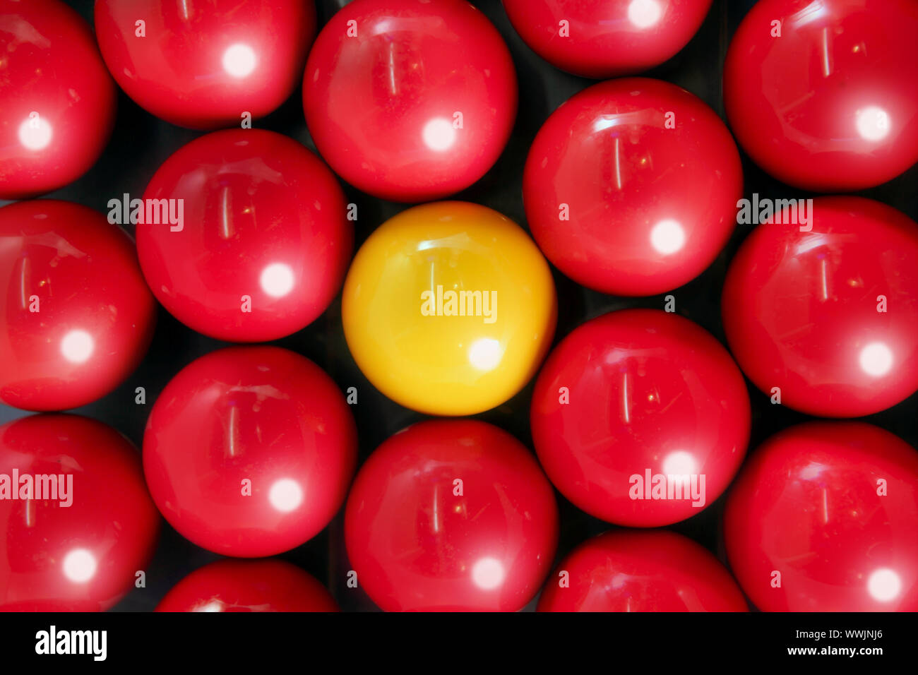 Alone billiard one yellow ball between many red balls background ...