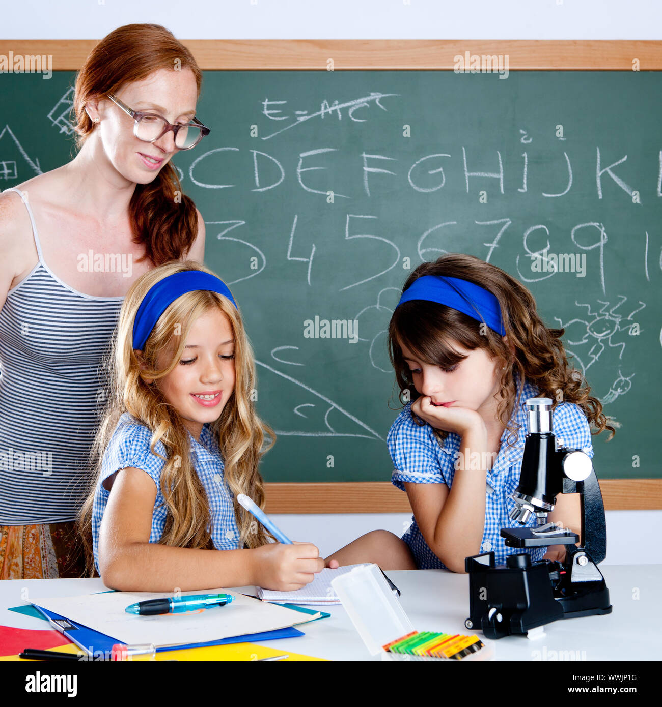 kids students with nerd teacher woman at school classroom Stock Photo ...