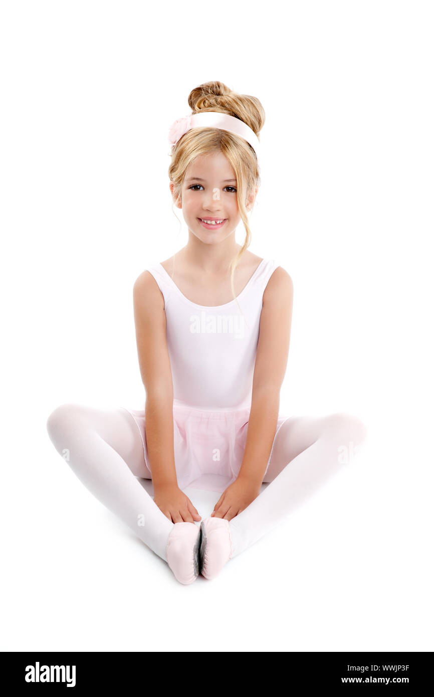 Ballerina children dancer sitting on white Stock Photo - Alamy