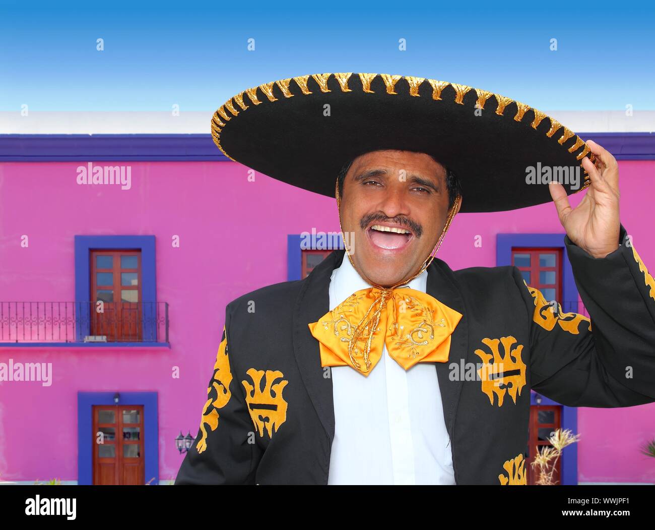 Charro mariachi man portrait shouting in mexican pink house Stock Photo ...