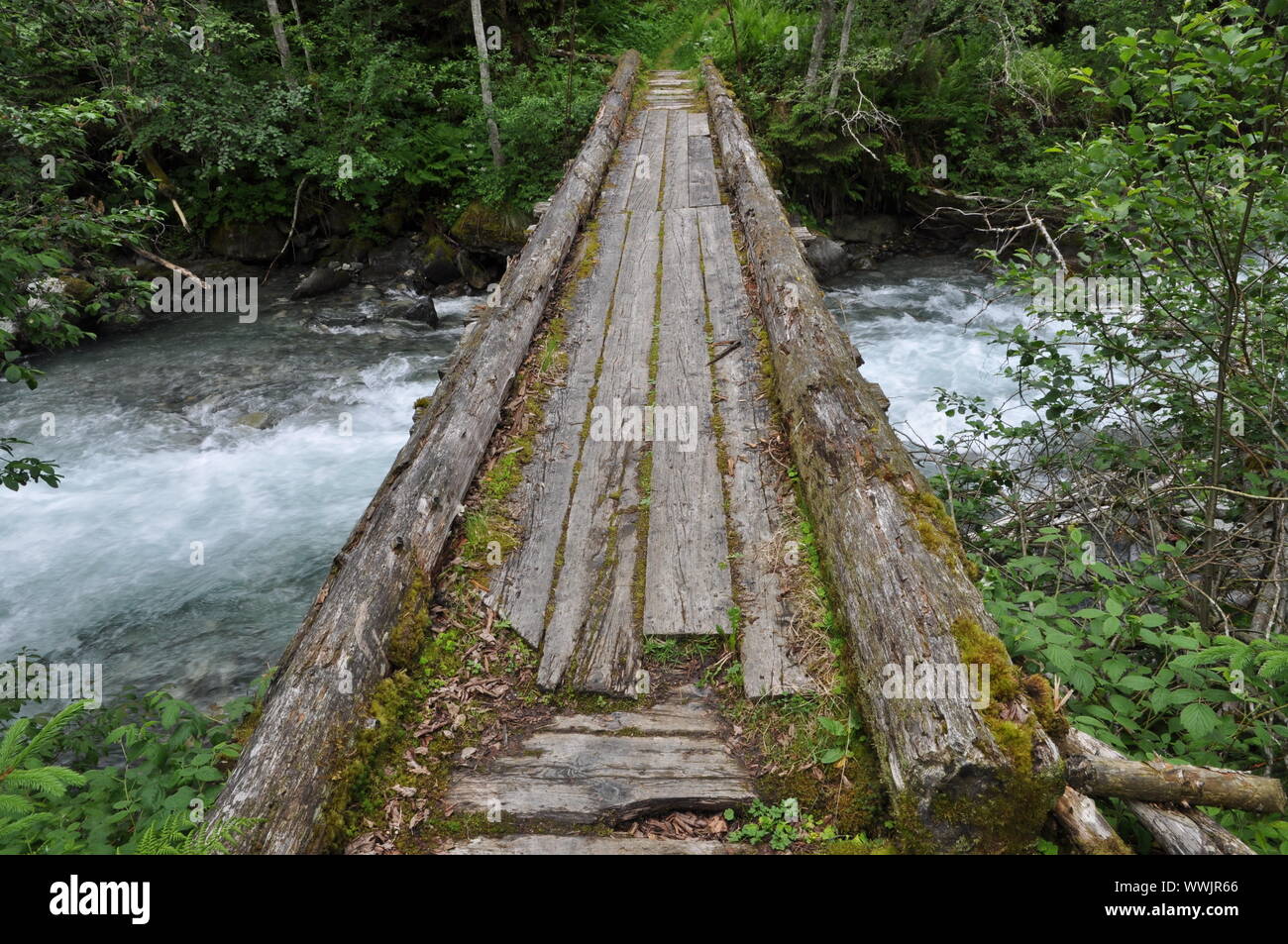 Bridge over a stream Stock Photo - Alamy