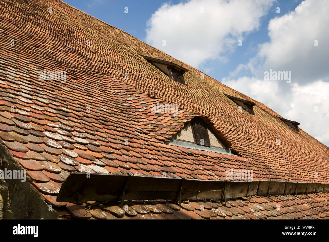 Old tiled roof with roof window Stock Photo - Alamy