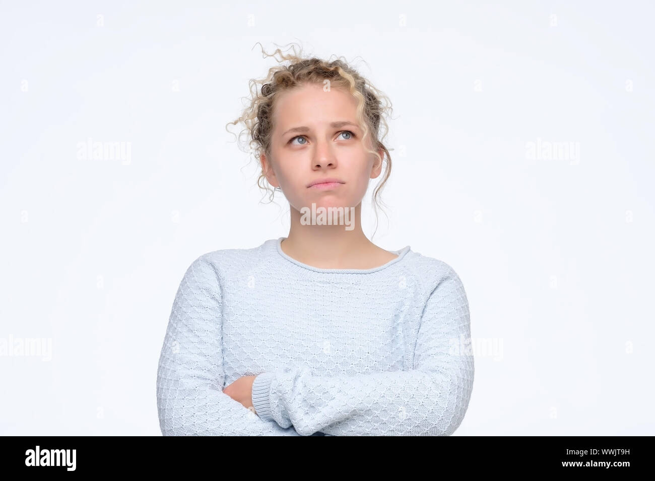 Head shot thinking touching chin hi-res stock photography and images ...