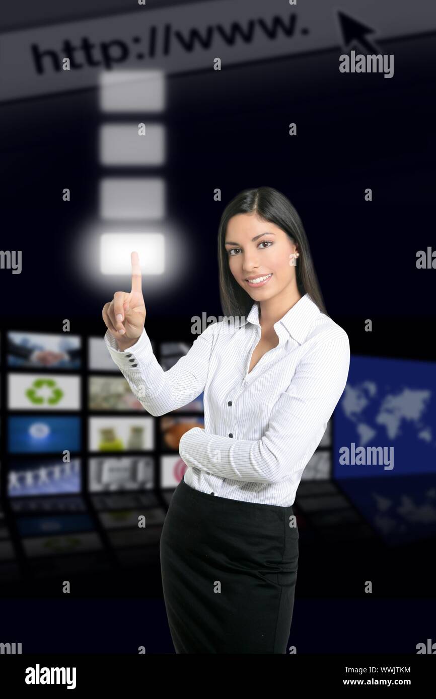 Brunette businesswoman touching virtual pad transparent key with finger ...